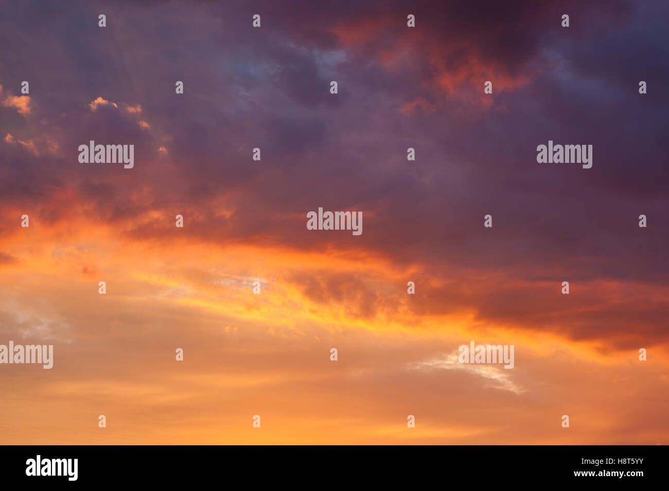 Fiery vivid sunset sky clouds Stock Photo - Alamy