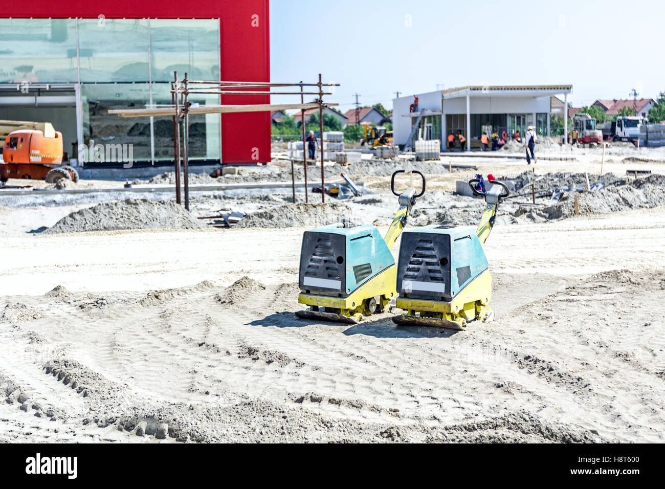 View on construction site with machinery, people at work. Landscape ...