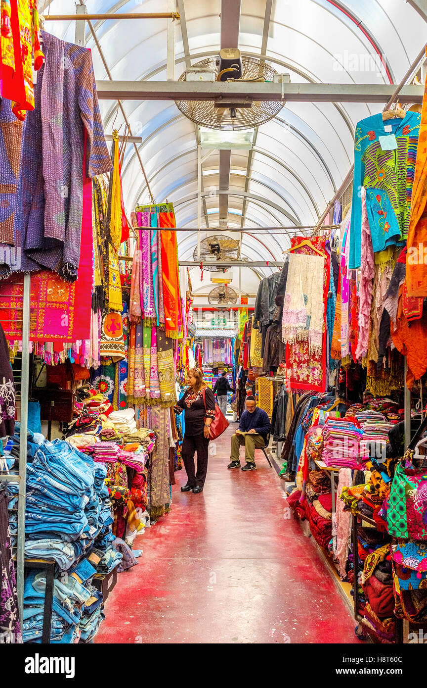 The covered clothes market in Jaffa with the wide range of different ...