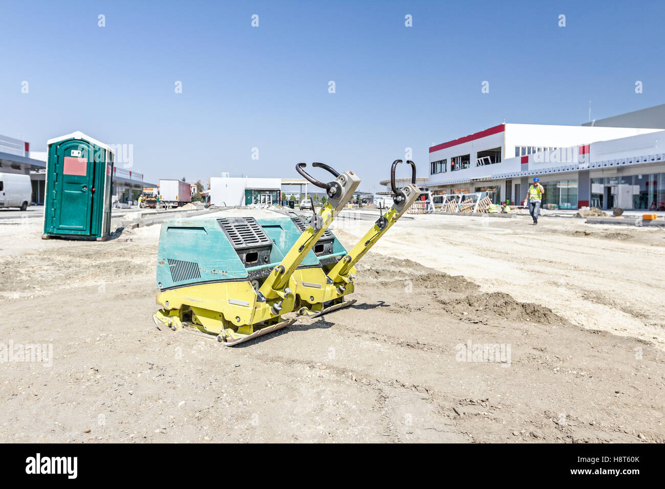 View on construction site with machinery, people at work. Landscape ...