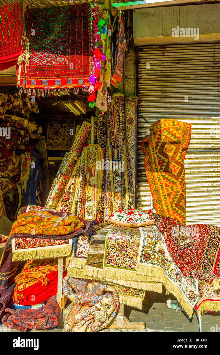 The colorful patterned silk rugs in the flea market stall of old Jaffa ...