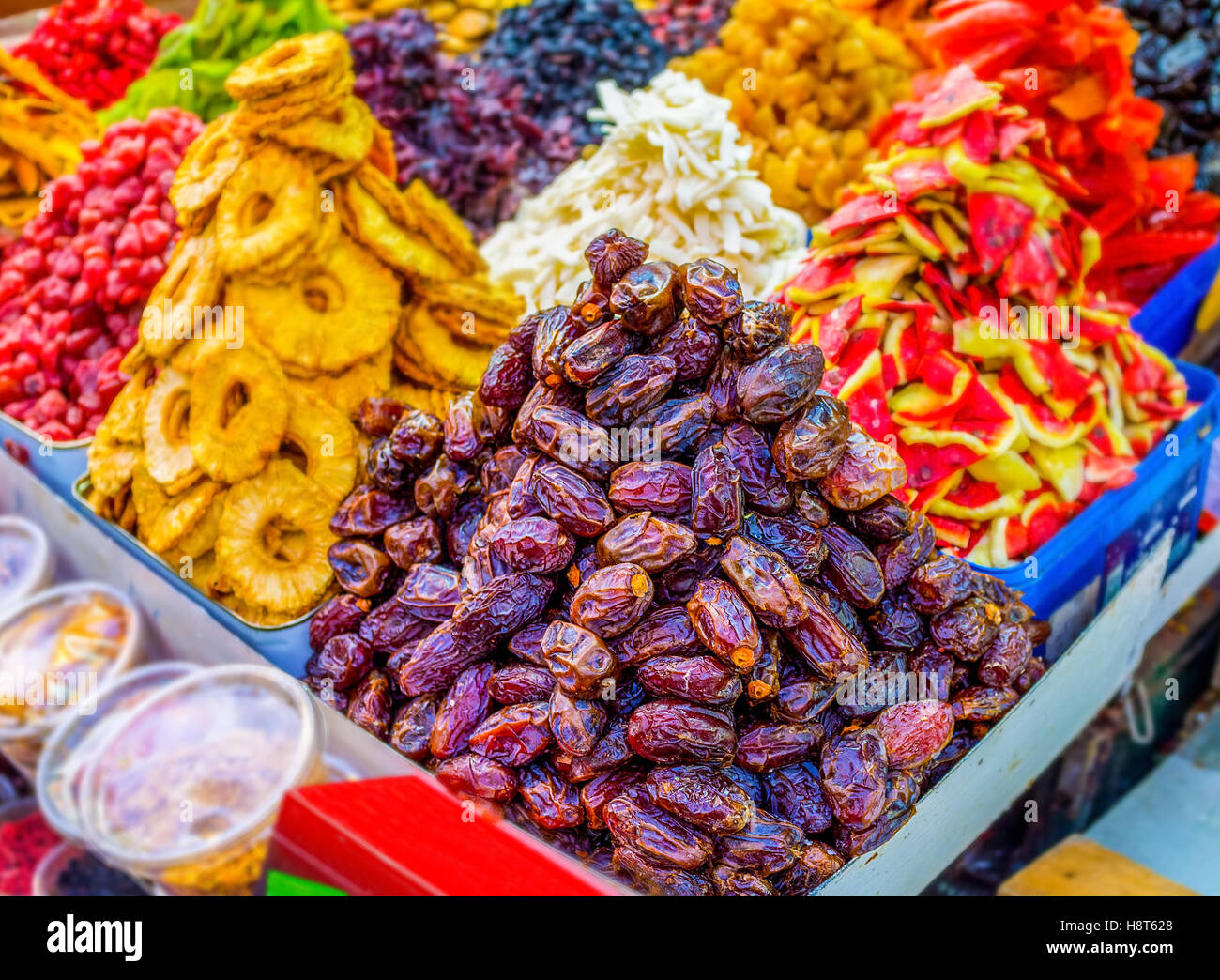 The tasty dried dates, pineapple and watermelon slices, different ...