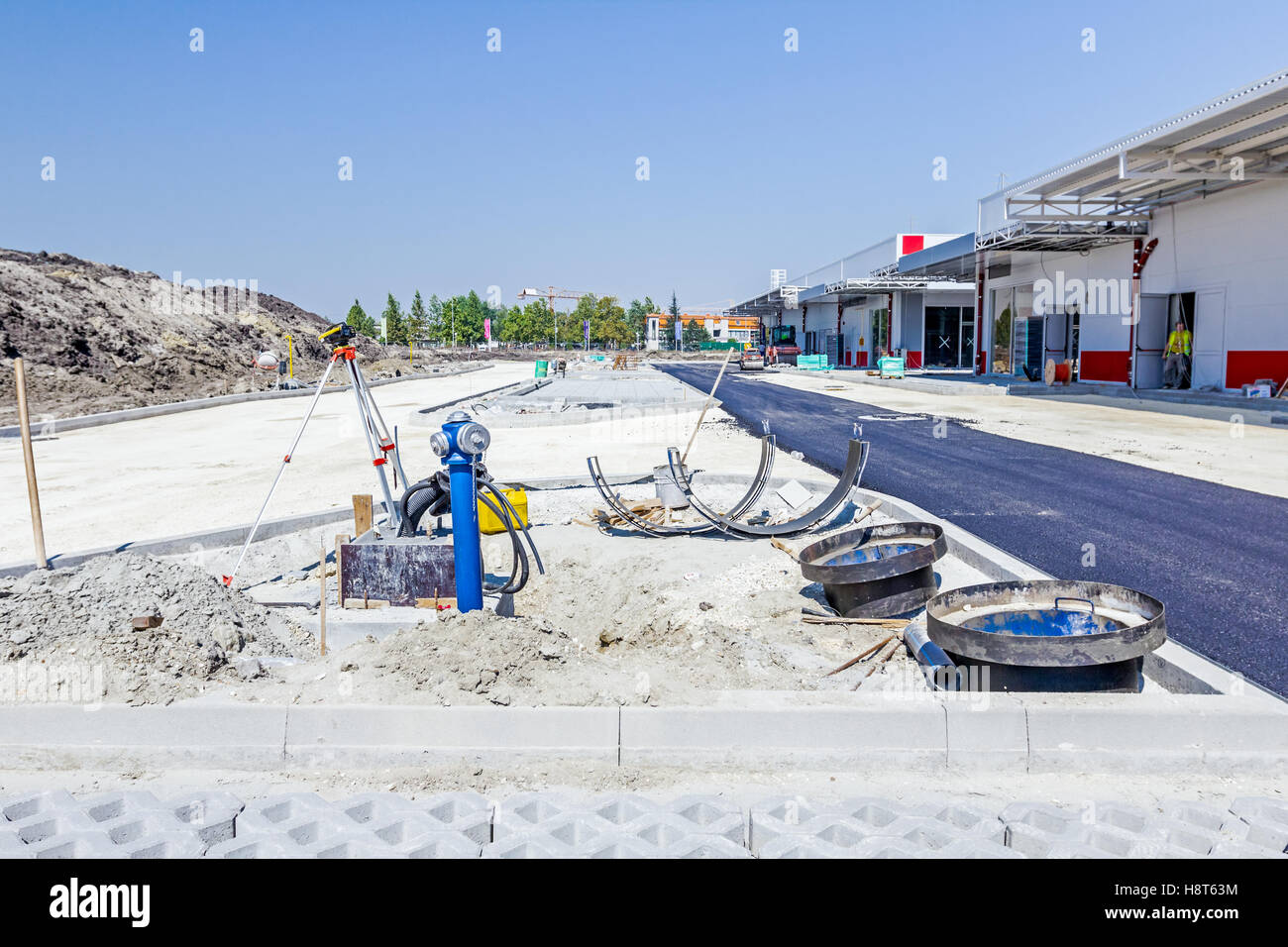 Newly placed fire hydrant with blue pipe is at building site Stock ...