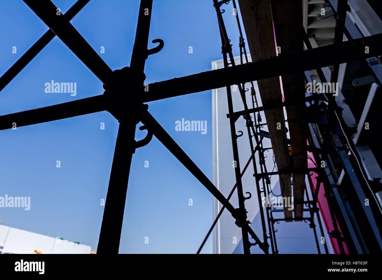 Silhouetted industrial shot node of scaffold against blue sky Stock ...