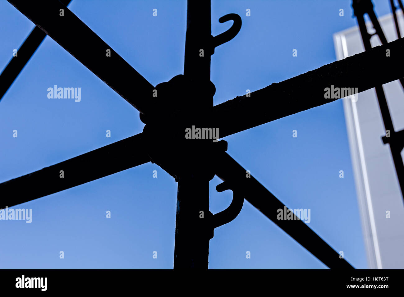 Silhouetted industrial shot node of scaffold against blue sky Stock ...