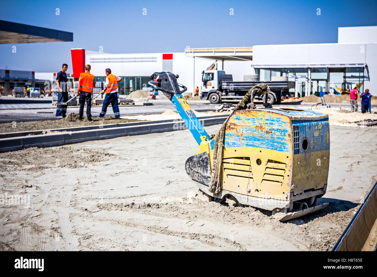 View on construction site with machinery, people at work. Landscape ...