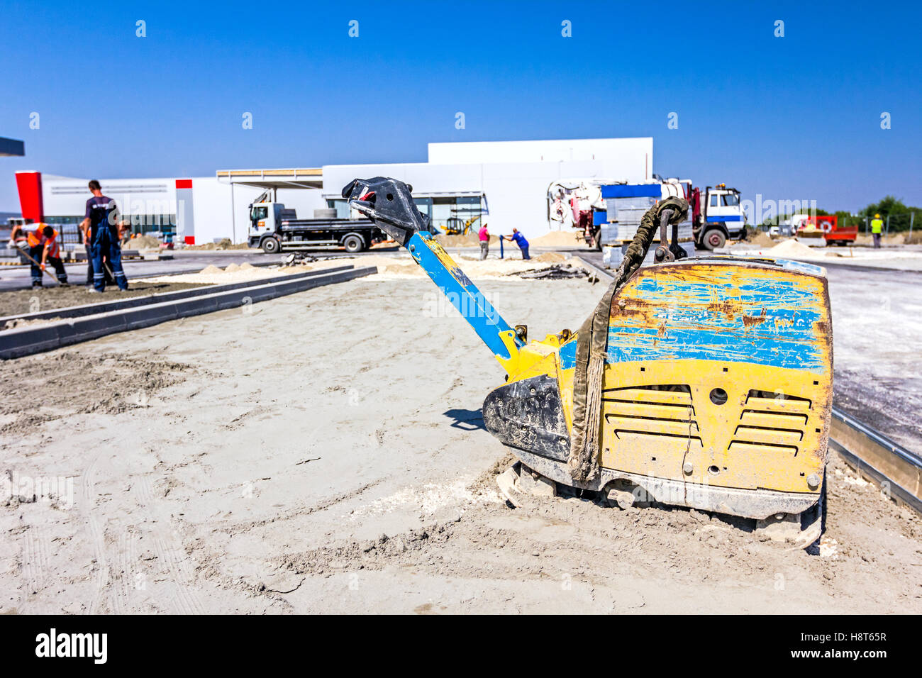 View on construction site with machinery, people at work. Landscape ...