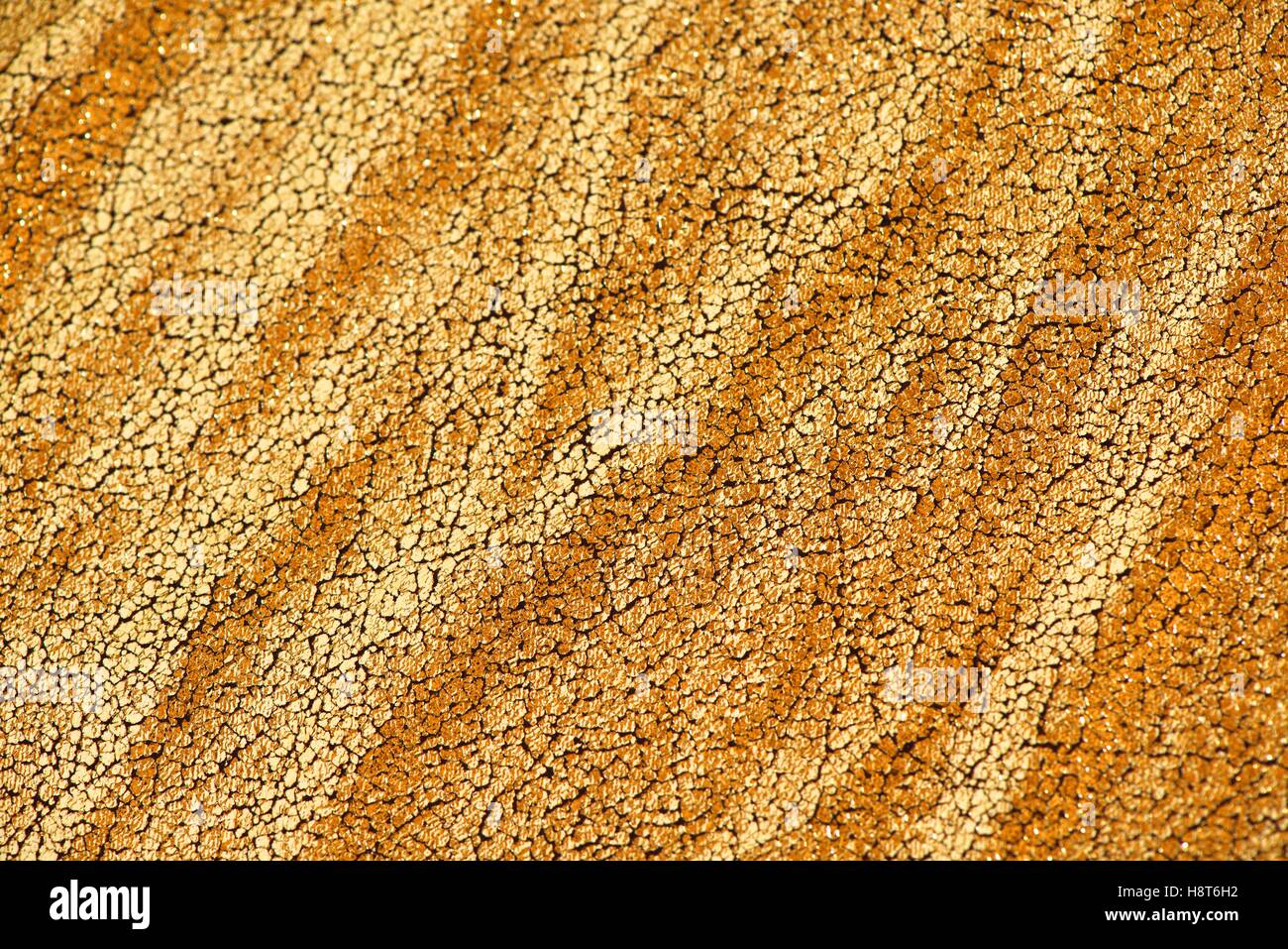 Uneven golden cloth with cracks Stock Photo - Alamy