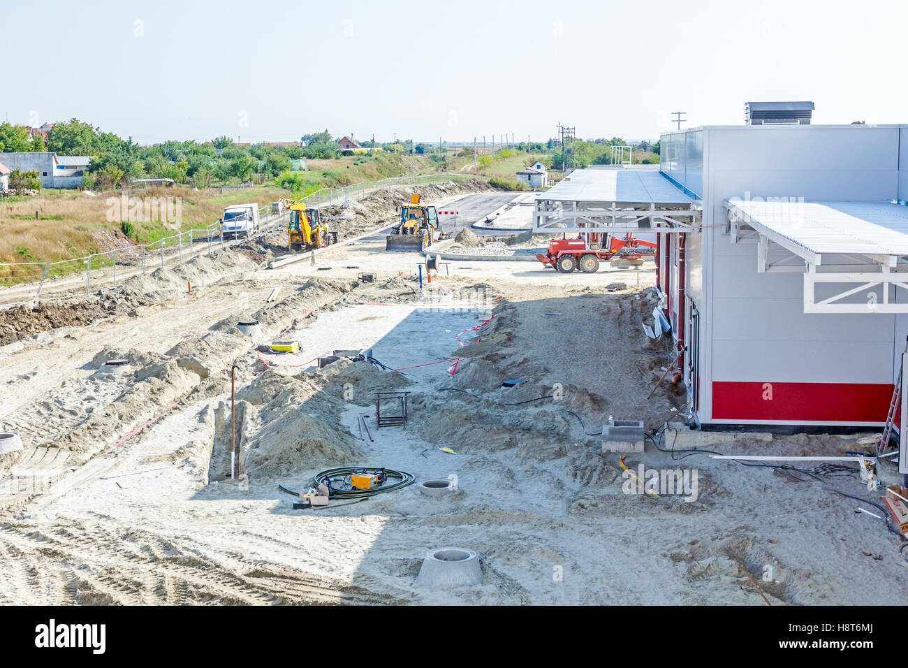 Landscape transform into urban area with machinery, people are working ...