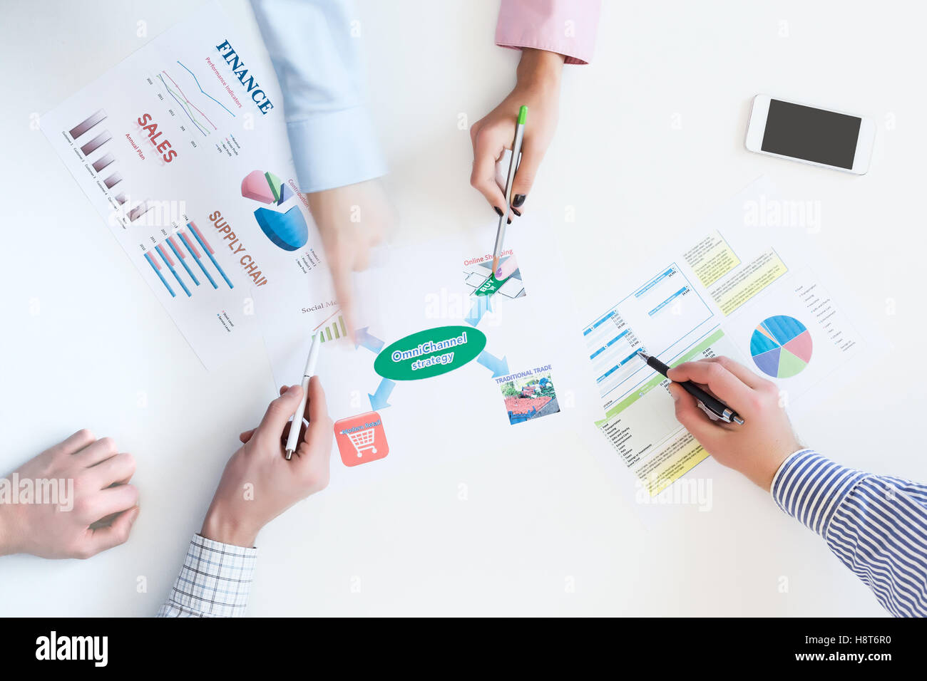 Group of Business People discussing Strategy top View Stock Photo - Alamy