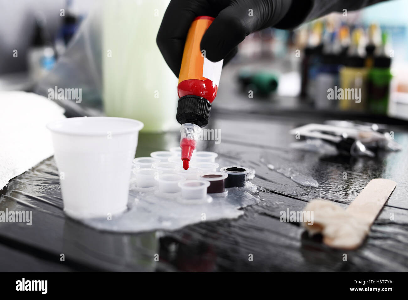 Color ink tattoo. Worktop in the tattoo studio Stock Photo - Alamy