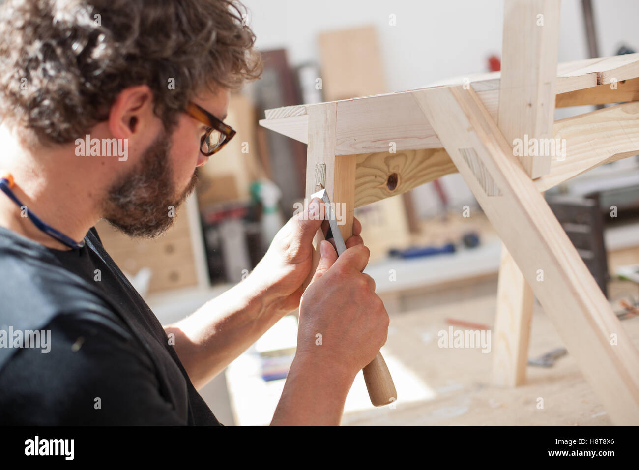 Furniture designer maker working in his workshop Stock Photo - Alamy