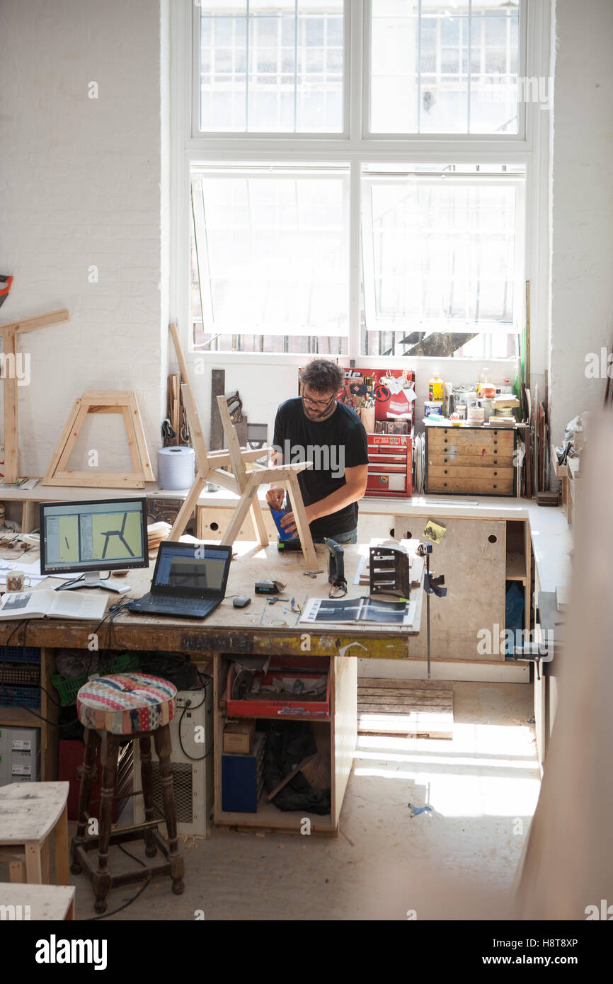 Furniture designer maker working in his workshop Stock Photo - Alamy