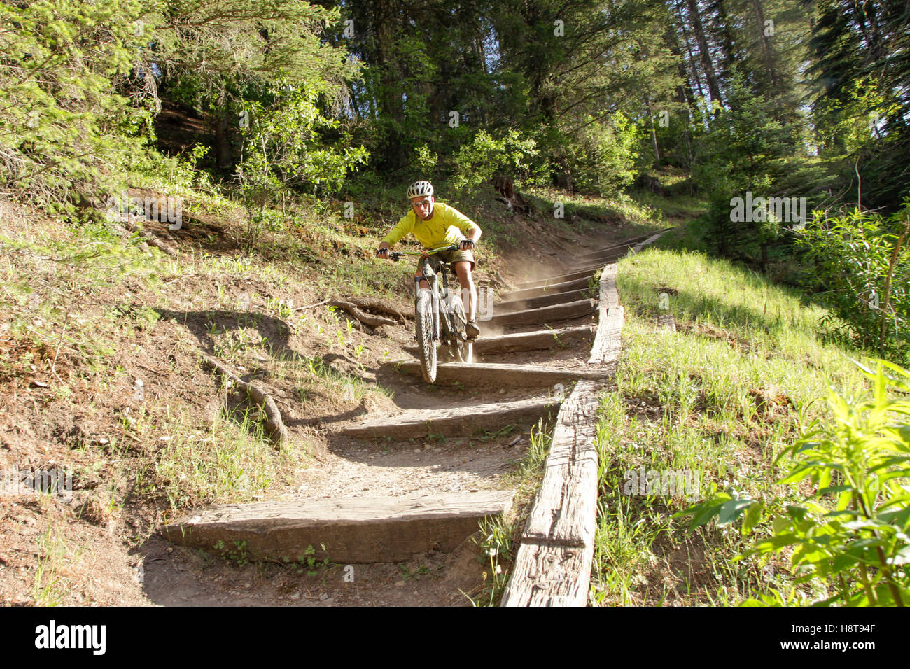 Daredevil mountain biker rides down stairs Stock Photo - Alamy