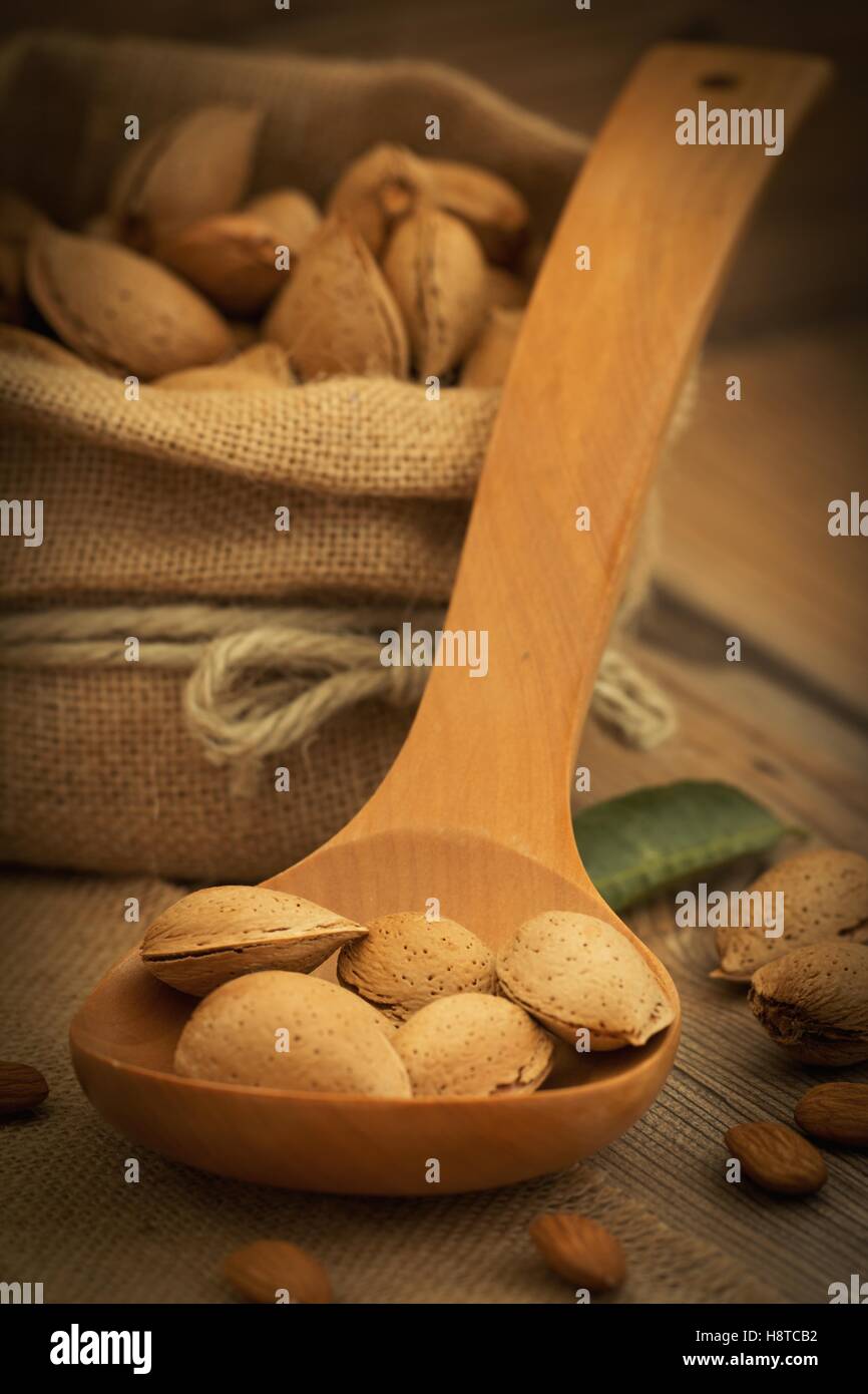 Almonds on brown wooden background. Beneficials for the brain Stock ...