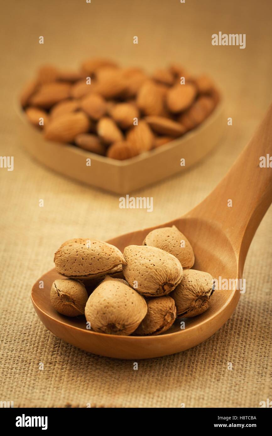 Almonds on brown wooden background. Beneficials for the brain Stock ...