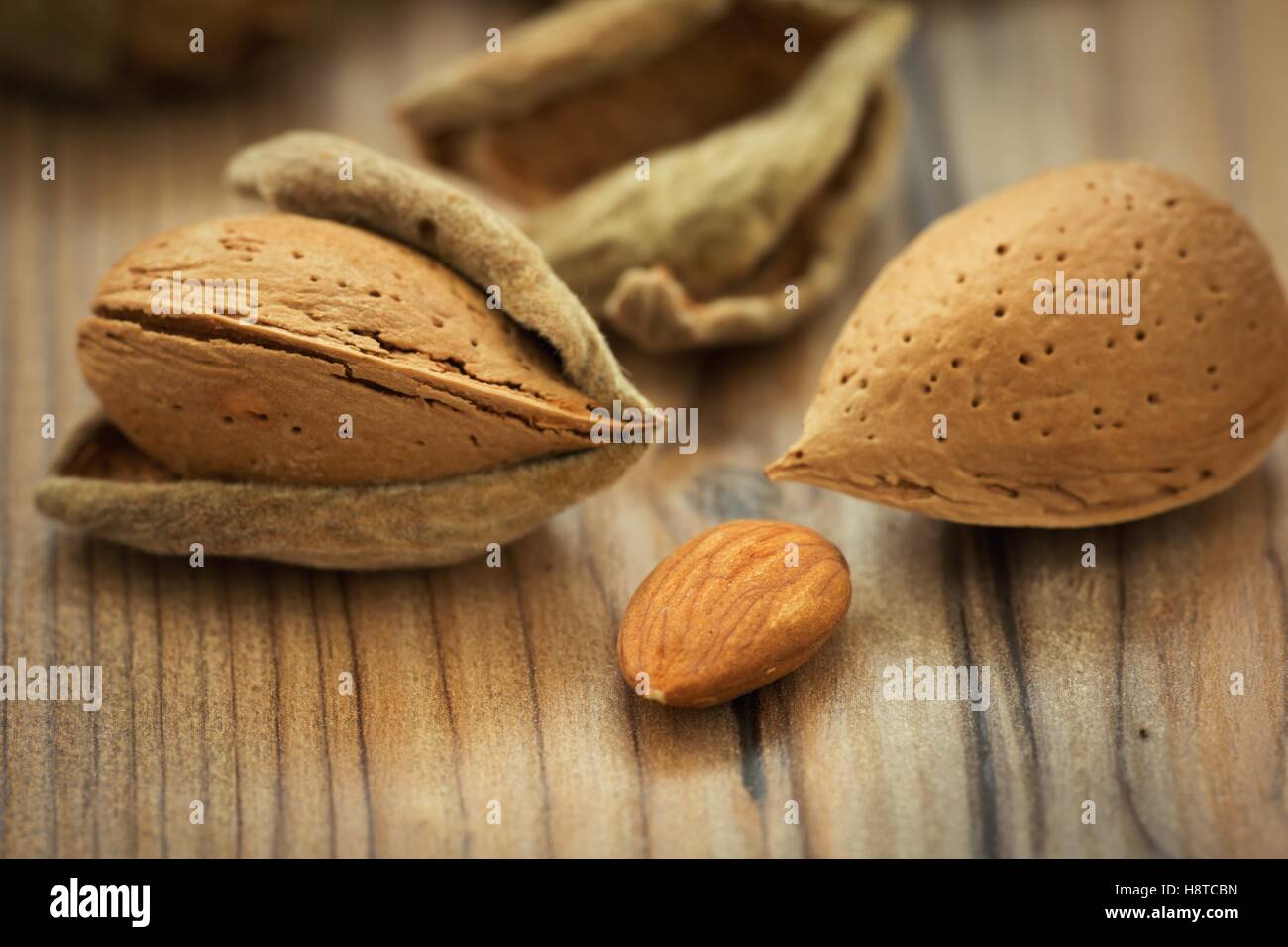Almonds on brown wooden background. Beneficials for the brain Stock ...