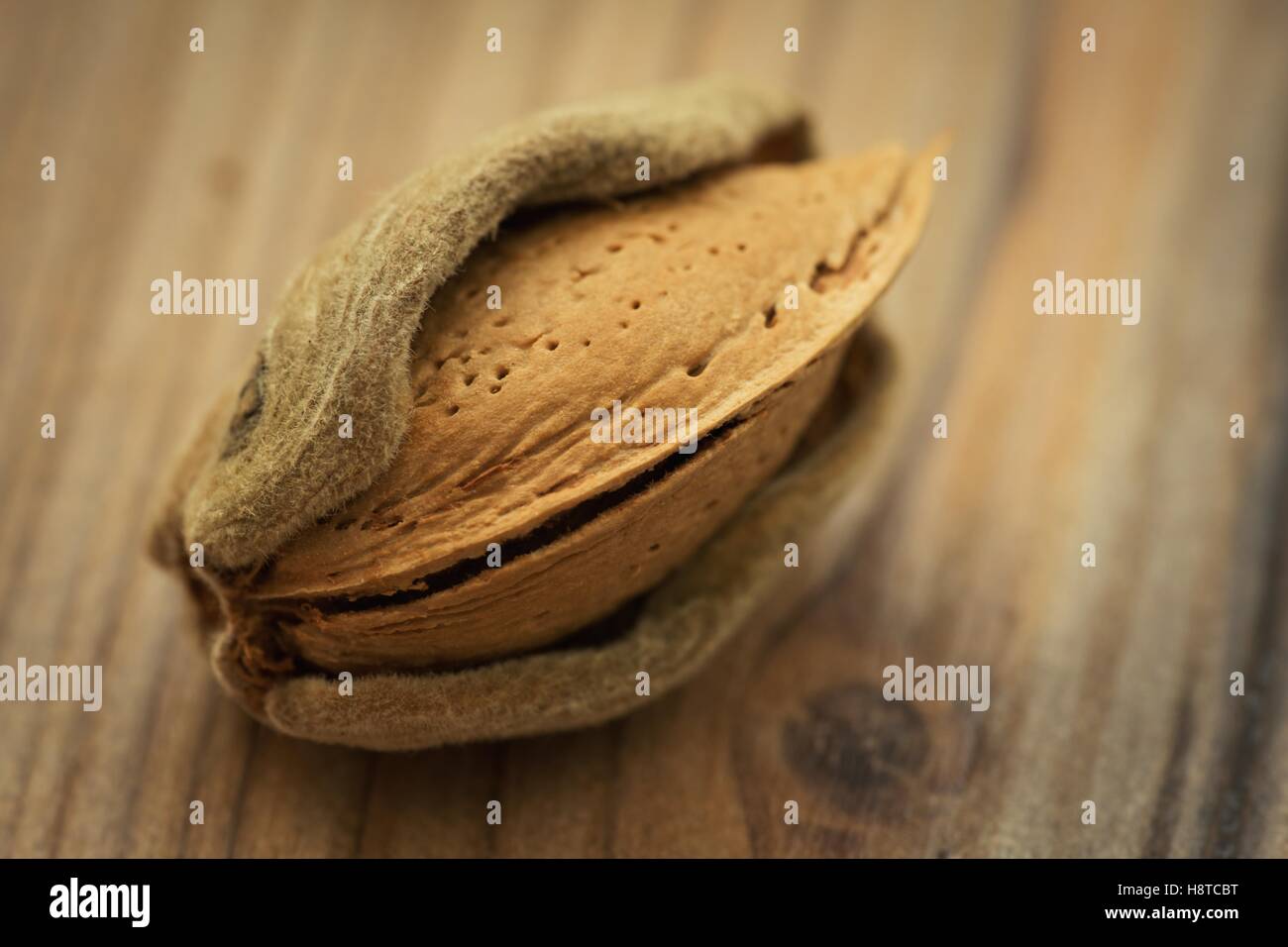 Almonds on brown wooden background. Beneficials for the brain Stock ...