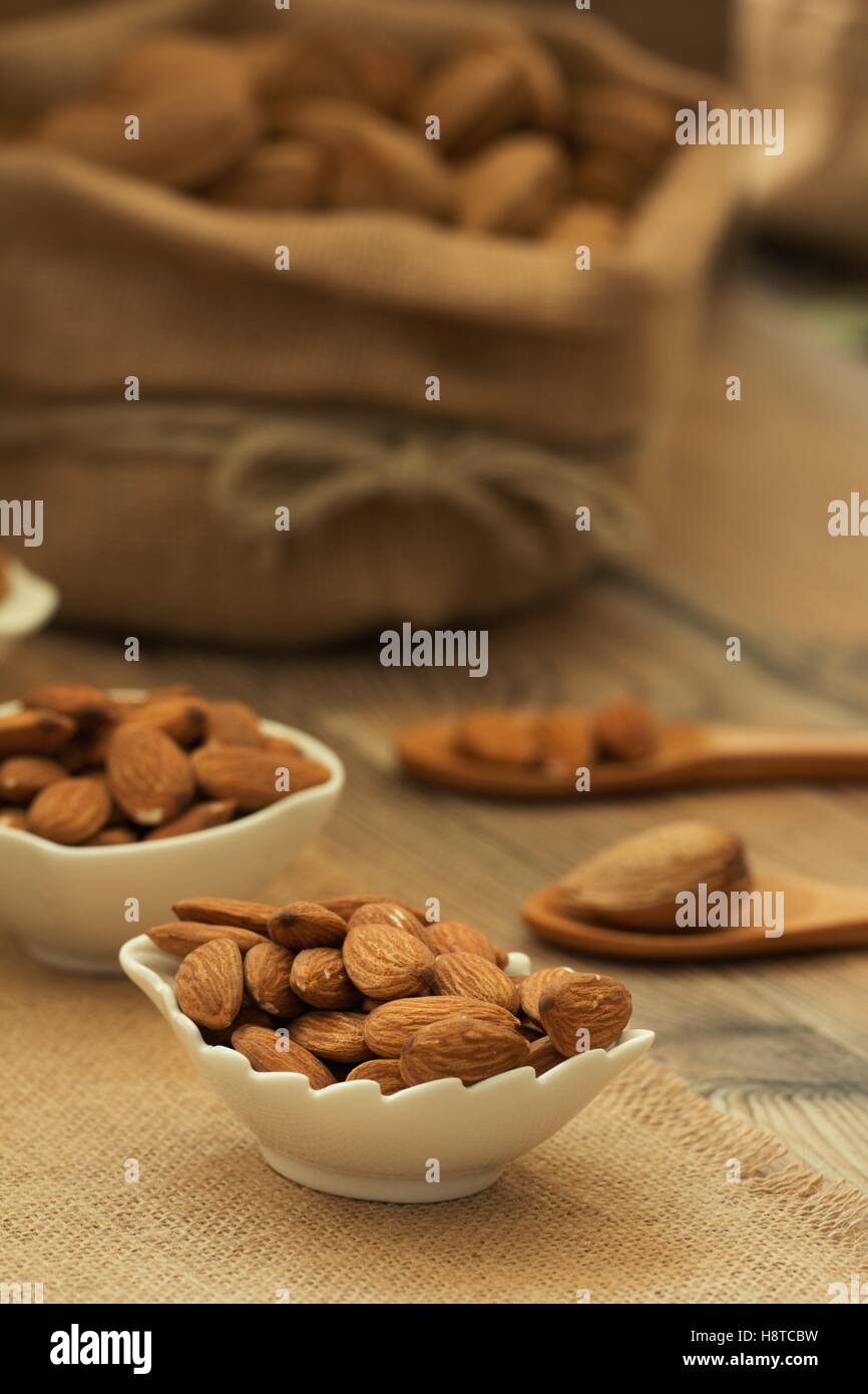 Almonds on brown wooden background. Beneficials for the brain Stock ...