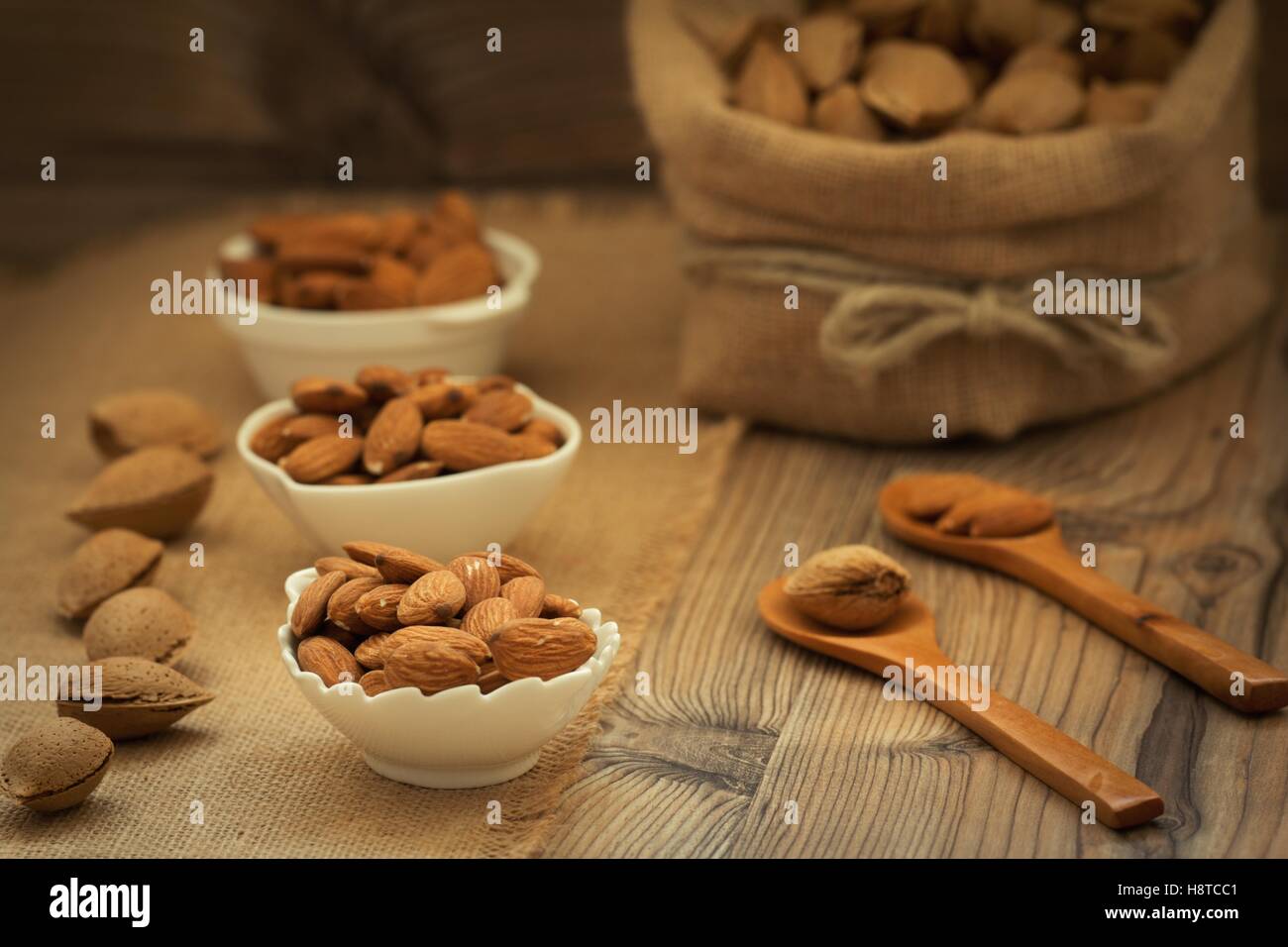 Almonds on brown wooden background. Beneficials for the brain Stock ...