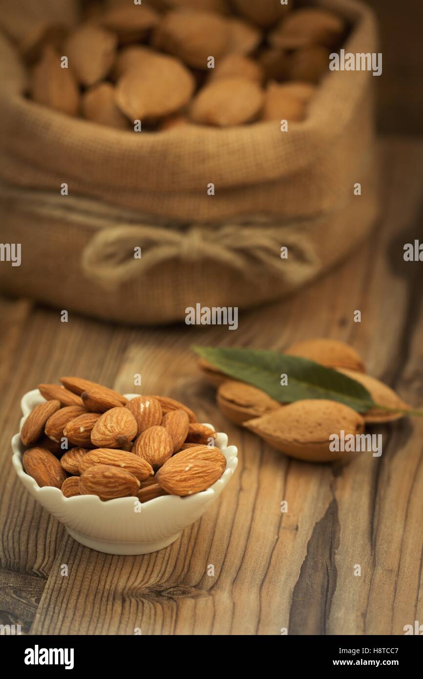 Almonds on brown wooden background. Beneficials for the brain Stock ...