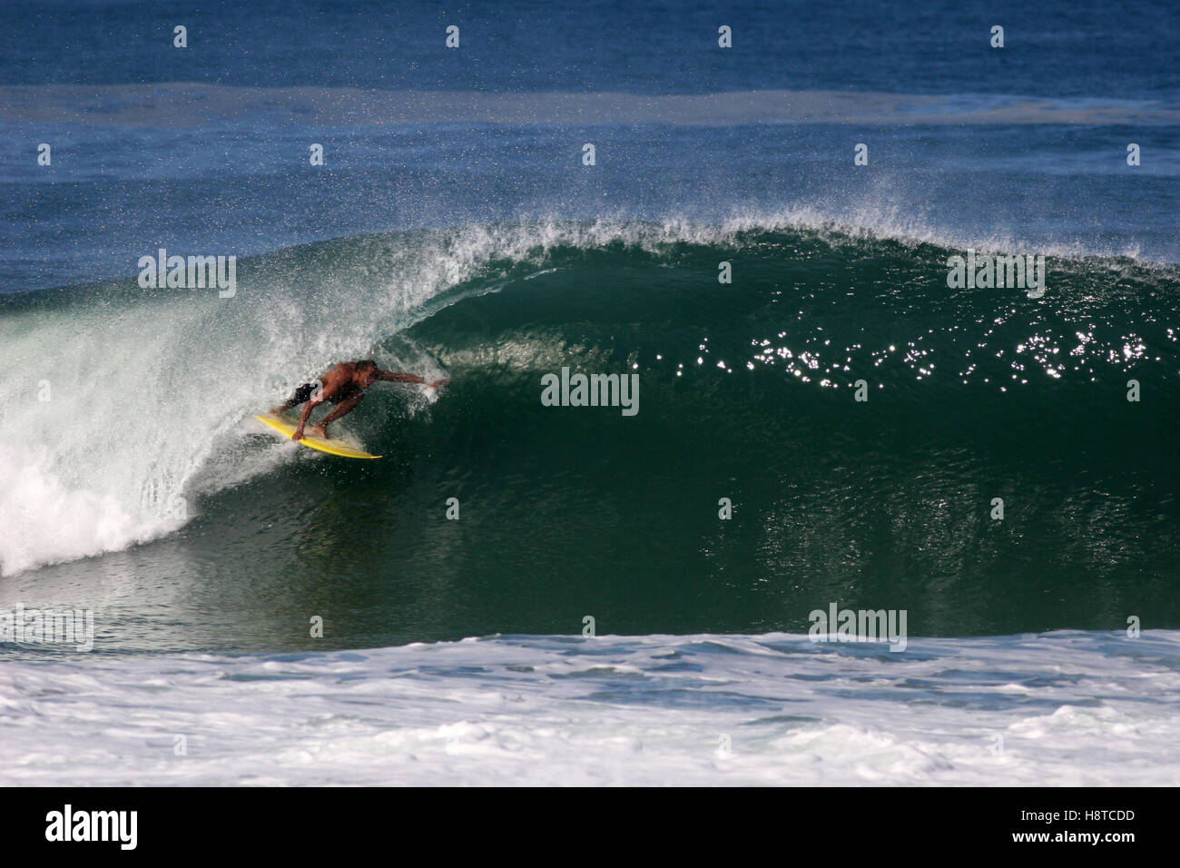 Surfer riding a tube Stock Photo - Alamy