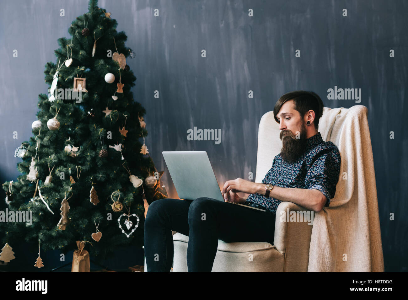 Man calmly browsing the Internet Stock Photo - Alamy