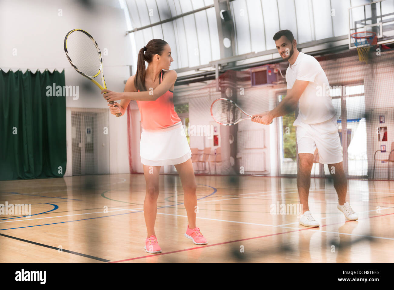 Trainer teaching to play tennis hi-res stock photography and images - Alamy