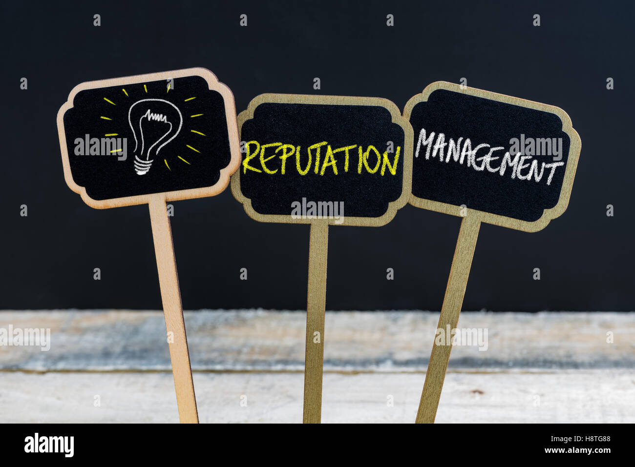 Concept message REPUTATION MANAGEMENT and light bulb as symbol for idea ...