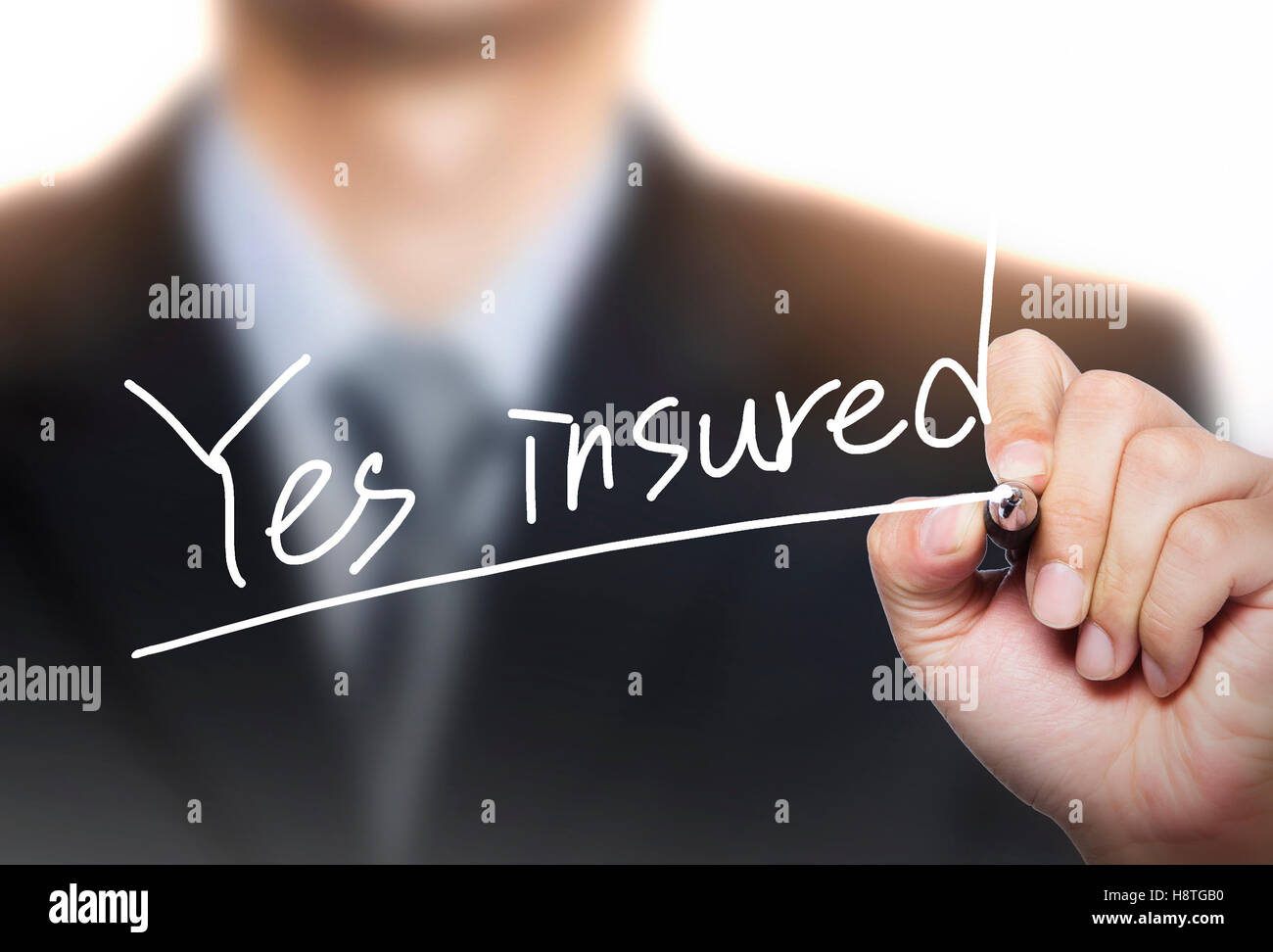 yes insured written by hand, hand writing on transparent board, photo ...