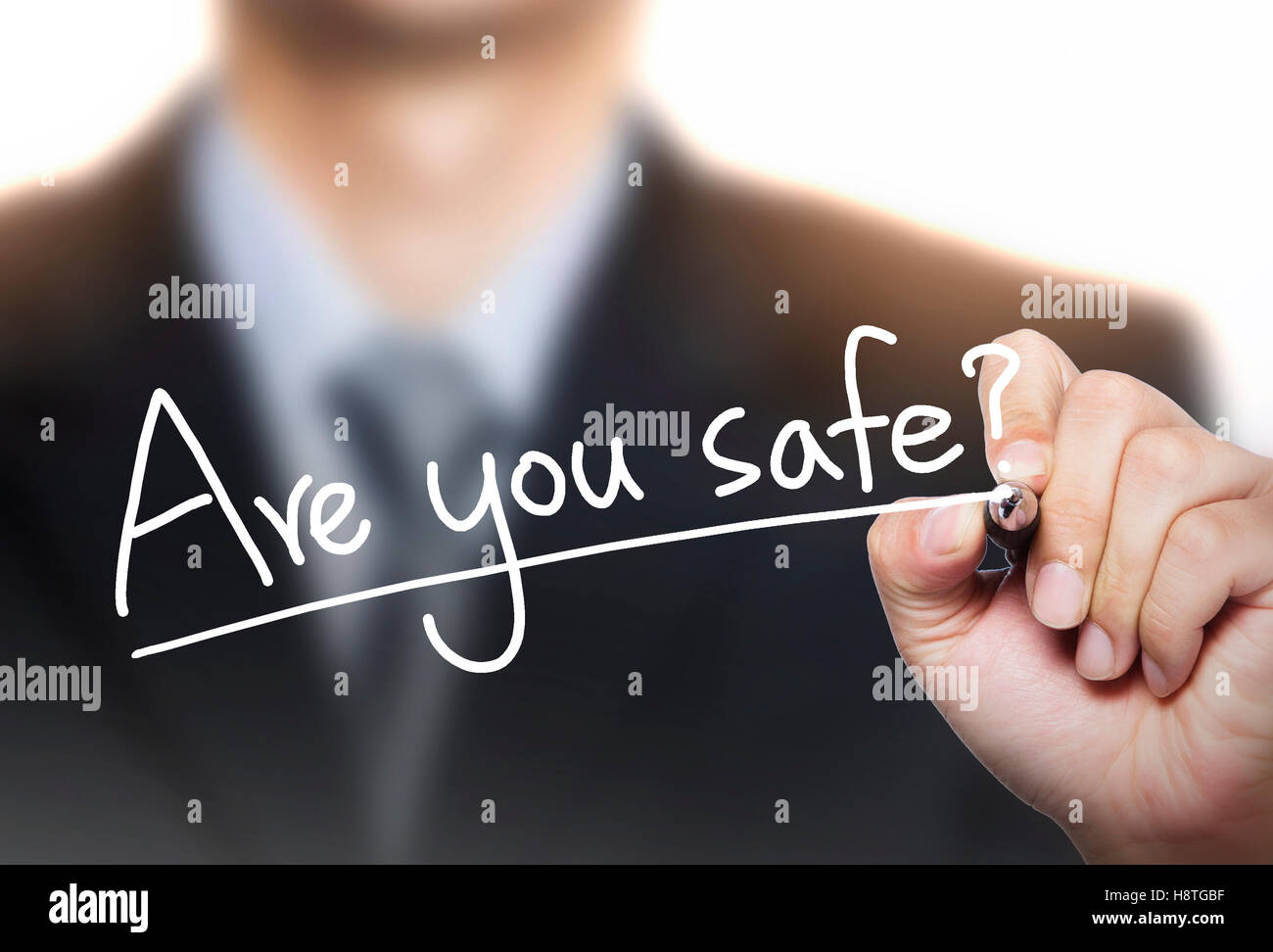 are you safe written by hand, hand writing on transparent board, photo ...