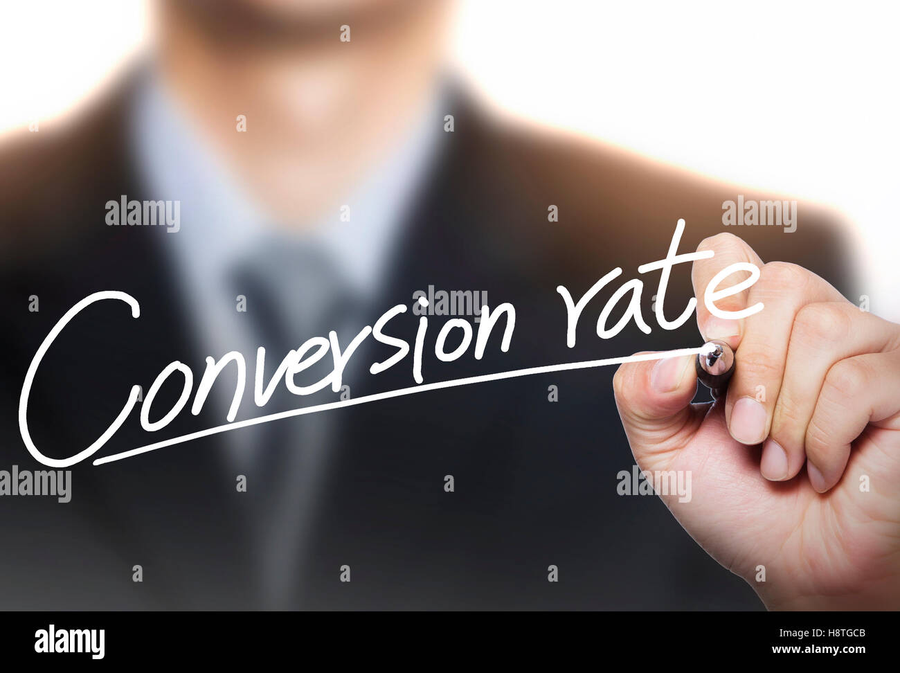 conversion rate written by hand, hand writing on transparent board ...