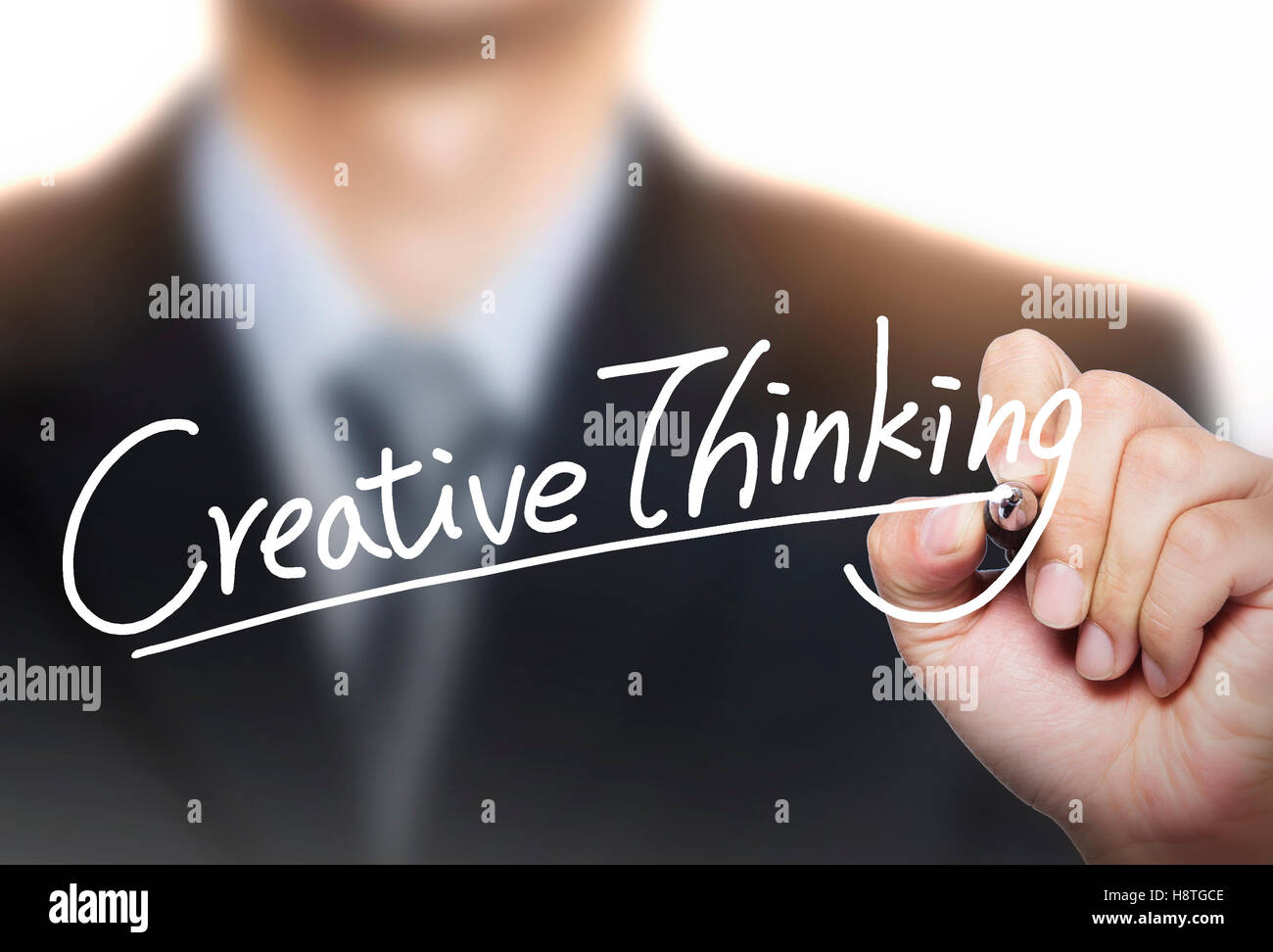 creative thinking written by hand, hand writing on transparent board ...
