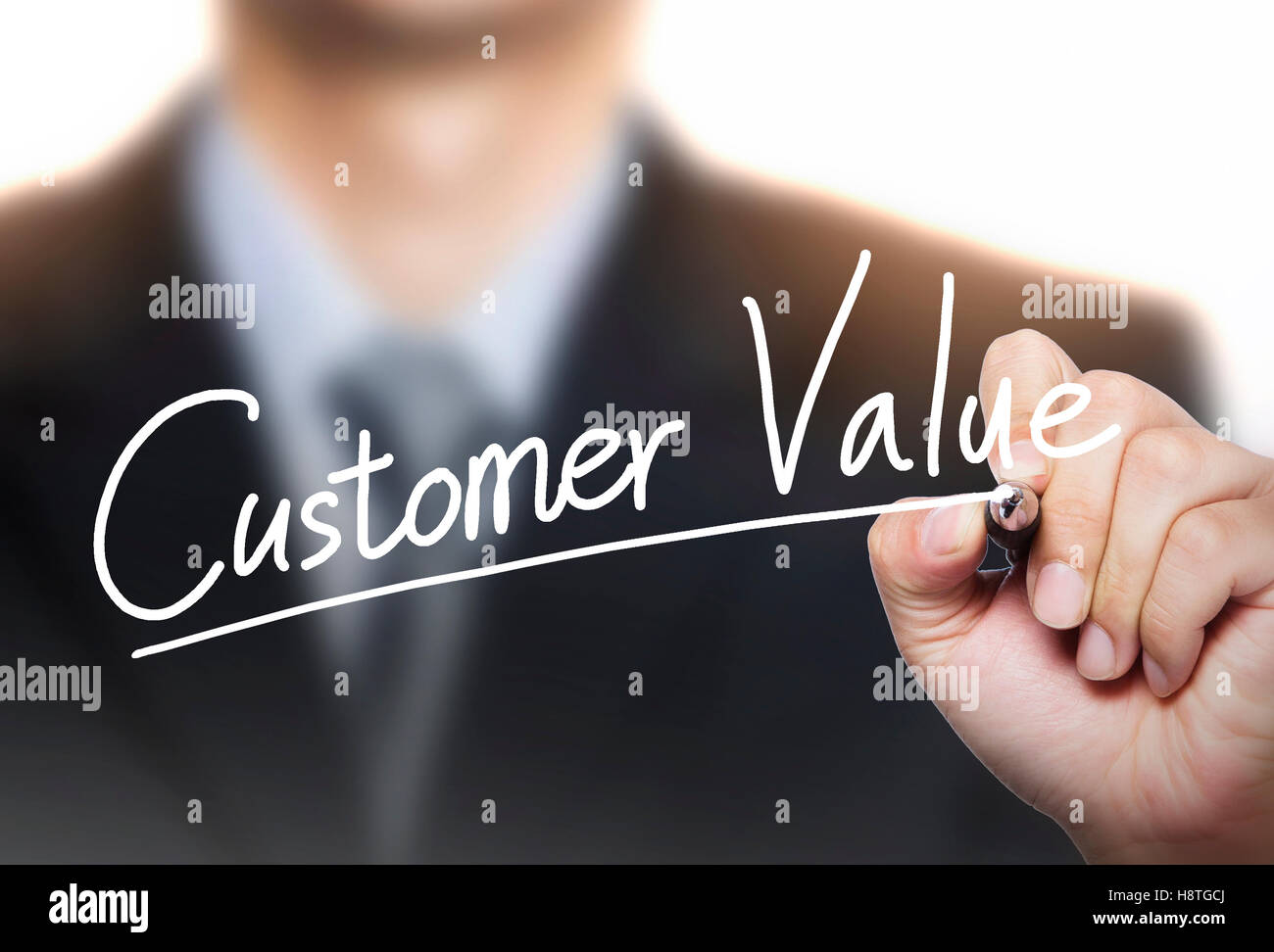 customer value written by hand, hand writing on transparent board ...