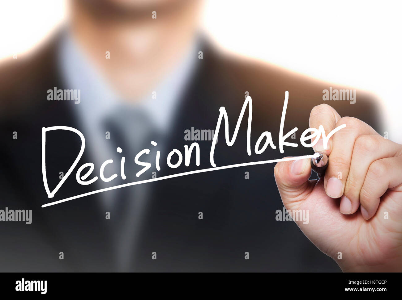 decision maker written by hand, hand writing on transparent board ...