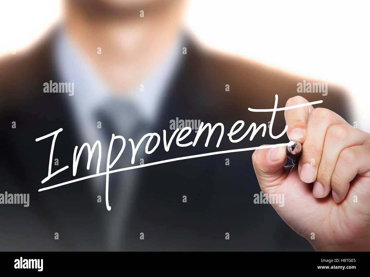 improvement written by hand, hand writing on transparent board, photo ...