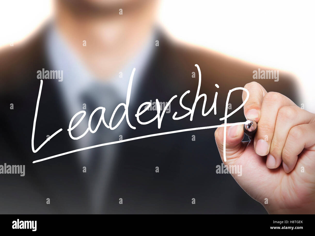 leadership written by hand, hand writing on transparent board, photo ...