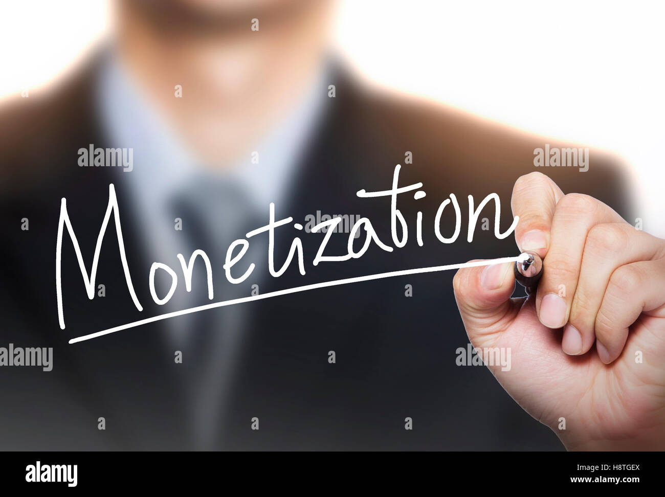 monetization written by hand, hand writing on transparent board, photo ...