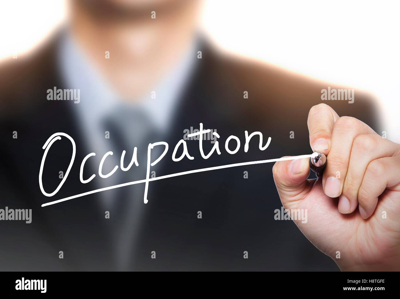 occupation written by hand, hand writing on transparent board, photo ...