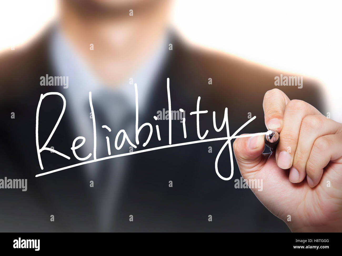reliability written by hand, hand writing on transparent board, photo ...