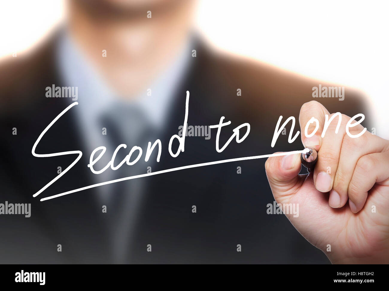 second to none written by hand, hand writing on transparent board ...