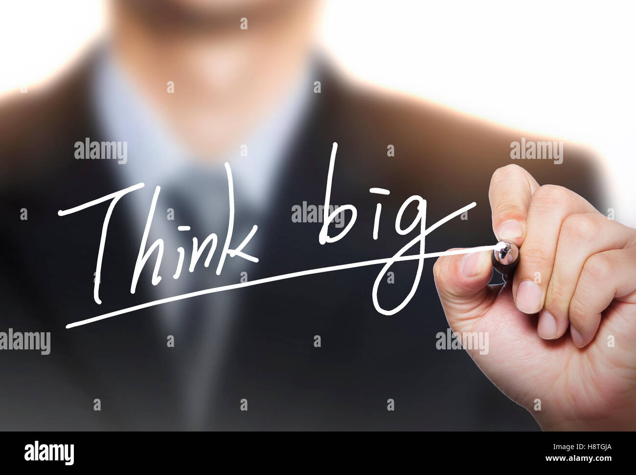 think big written by hand, hand writing on transparent board, photo ...