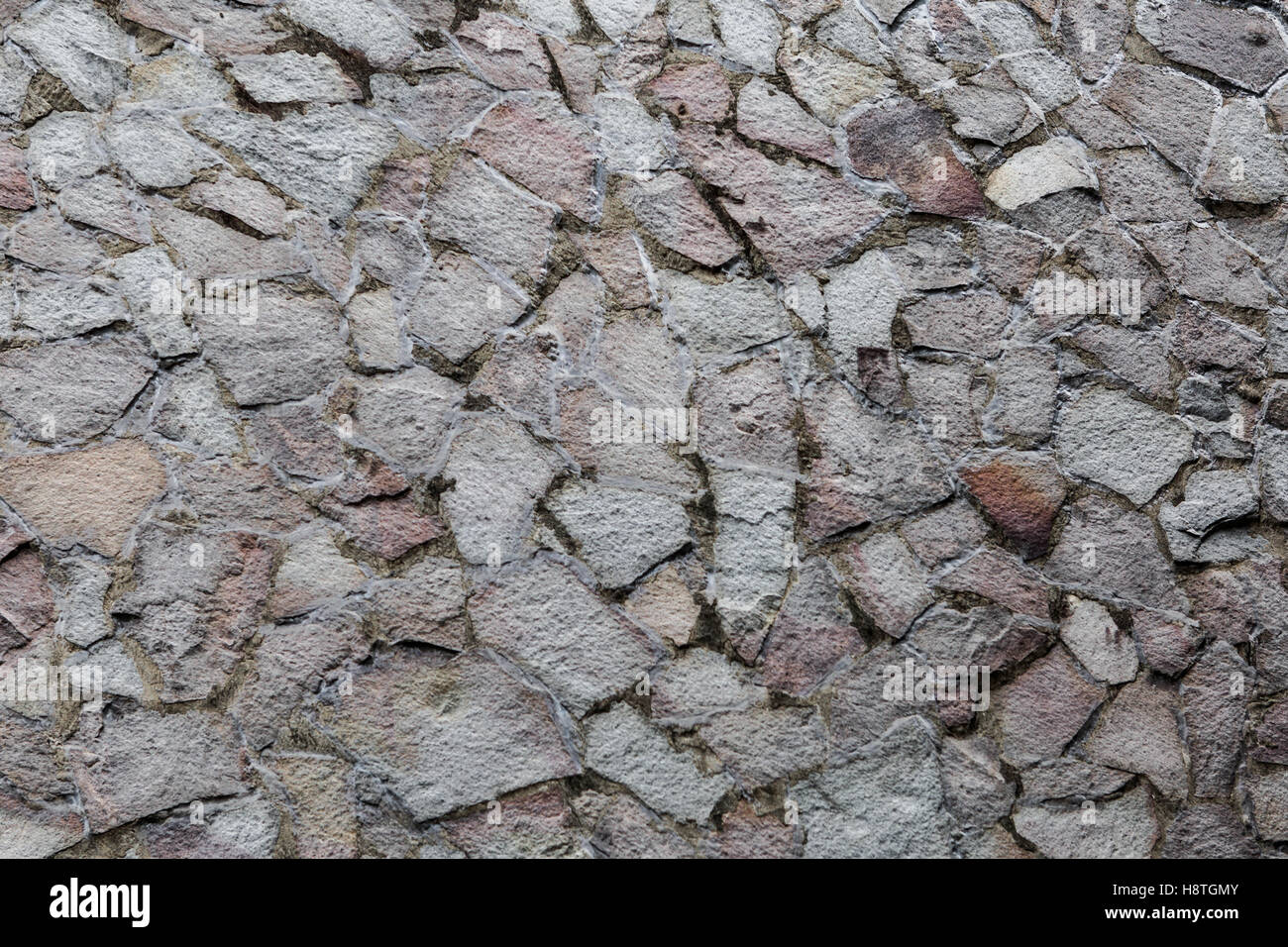 Stone wall background, close up look of rough rock wall for design ...