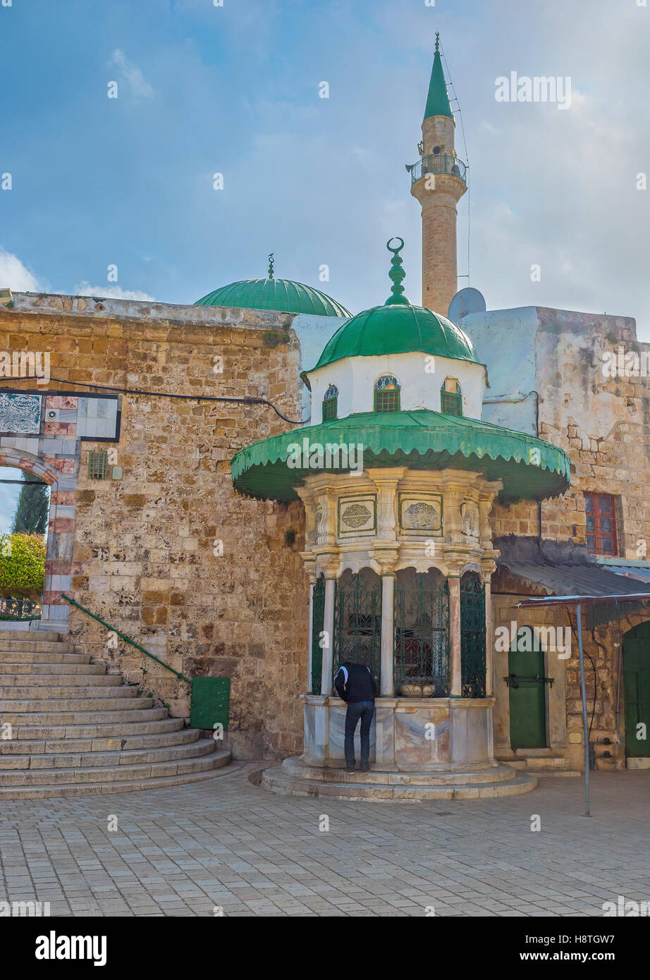 The central entrance to Al-Jazzar mosque with white sabil, built in ...