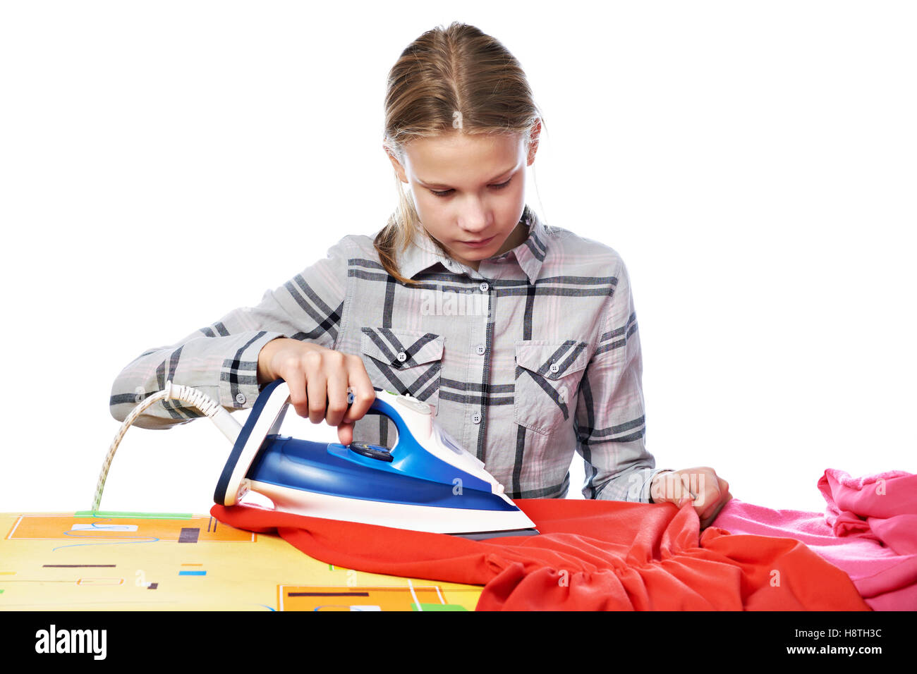 Girl with washed linen around the ironing board with iron isolated ...