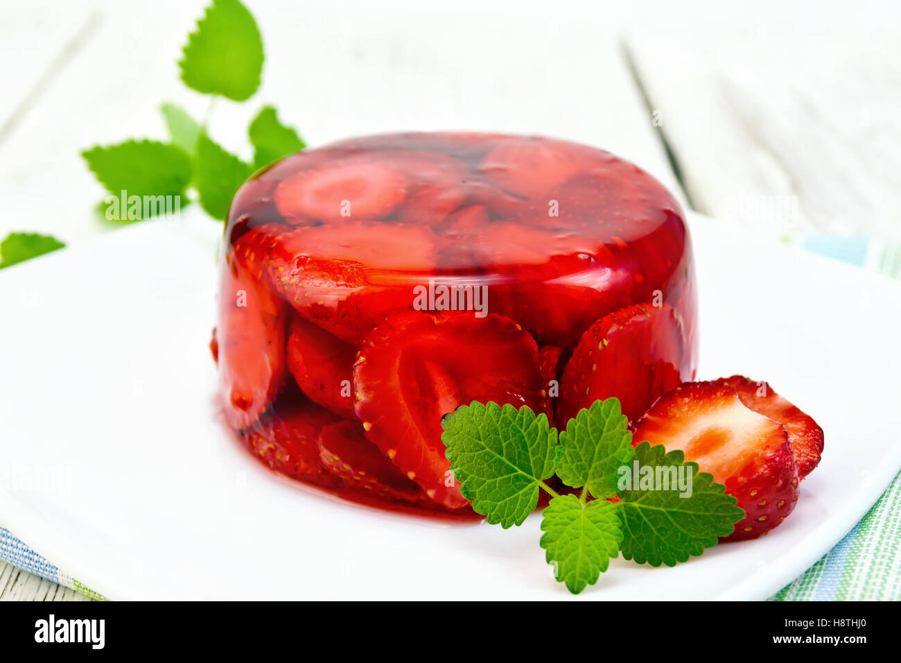 Jelly strawberry with mint on table Stock Photo - Alamy