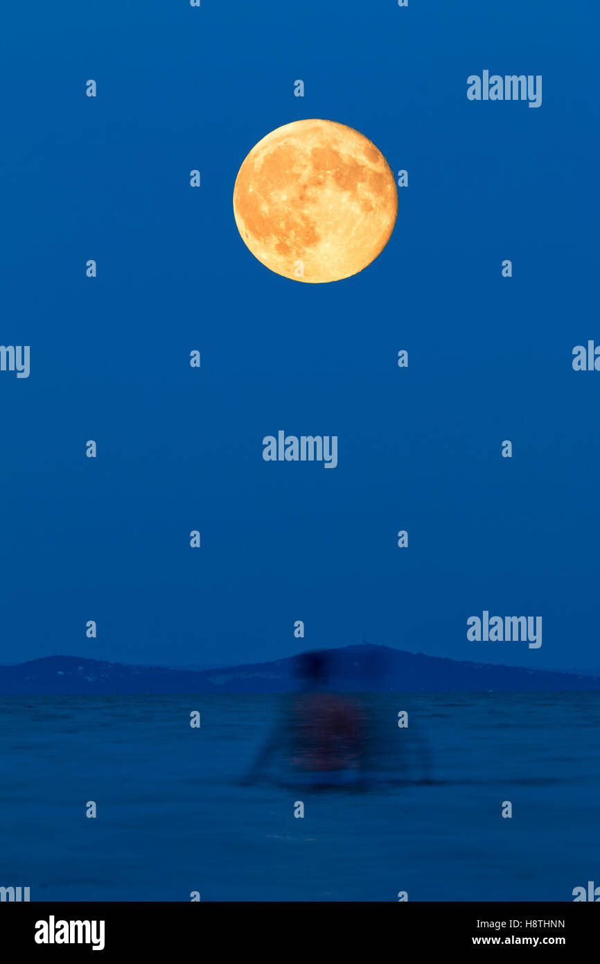 Full moon over the lake on the beach,long exposure Stock Photo - Alamy