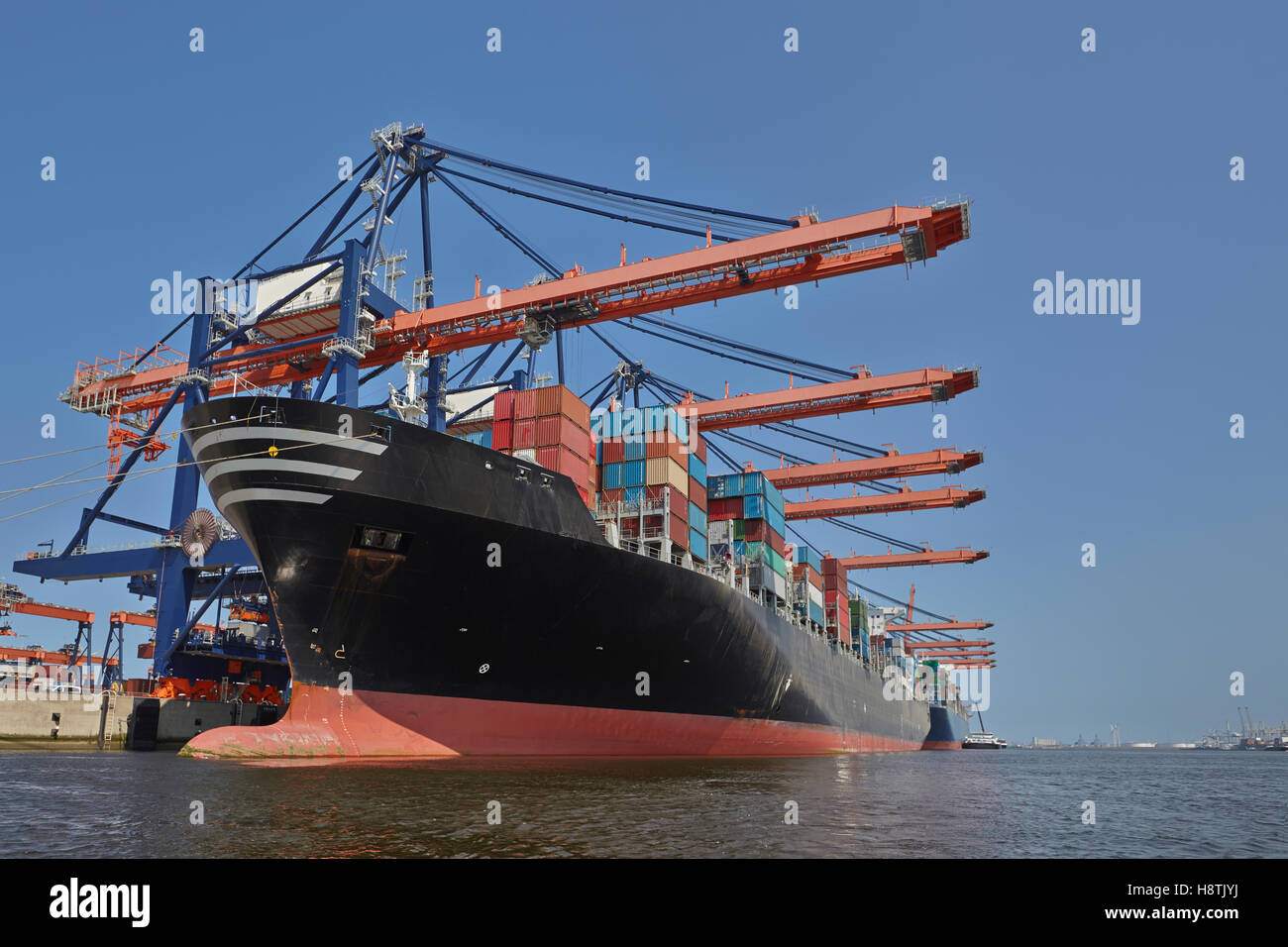 Freight ship under loading in the Port of Rotterdam Stock Photo - Alamy
