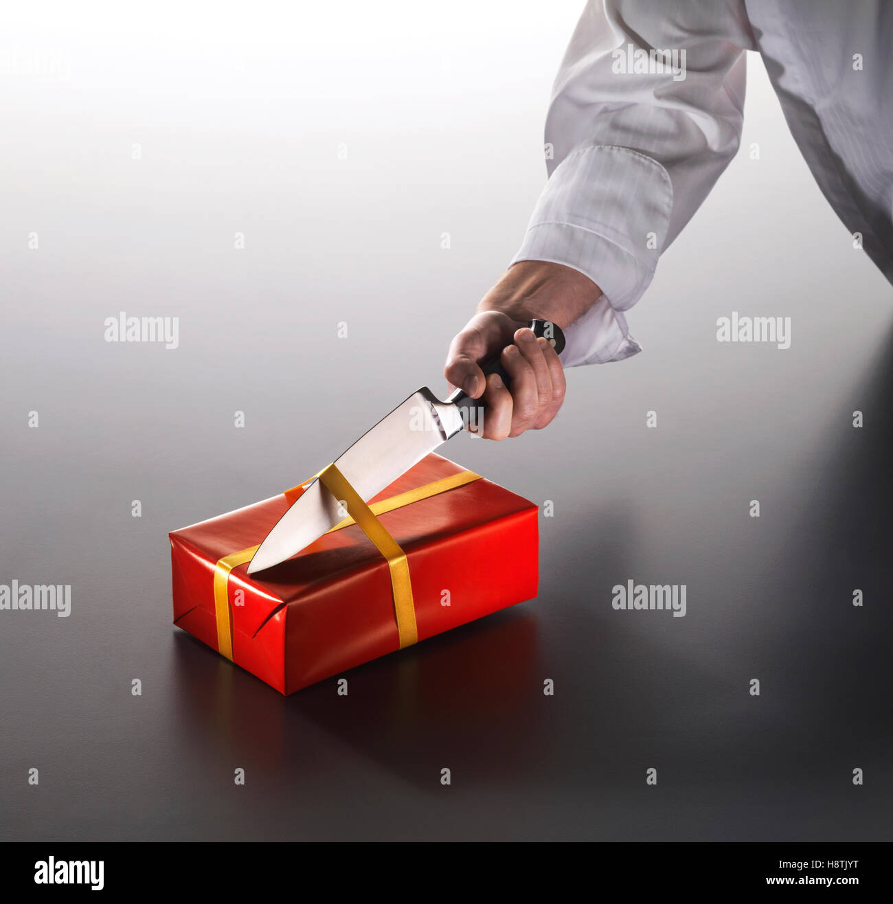 Giving present knife hi-res stock photography and images - Alamy