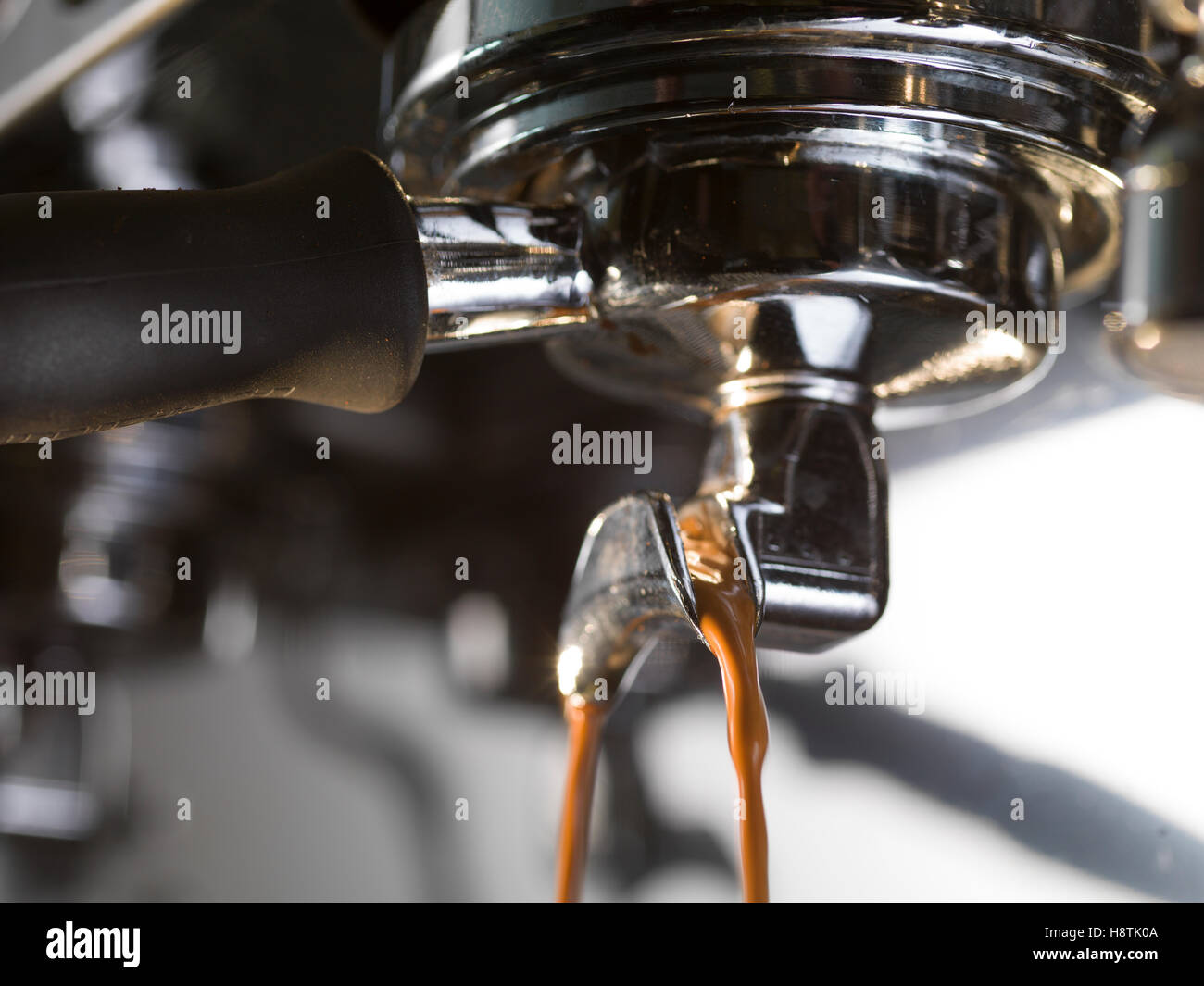 espresso extraction with a proffessional coffee machine, close up Stock ...